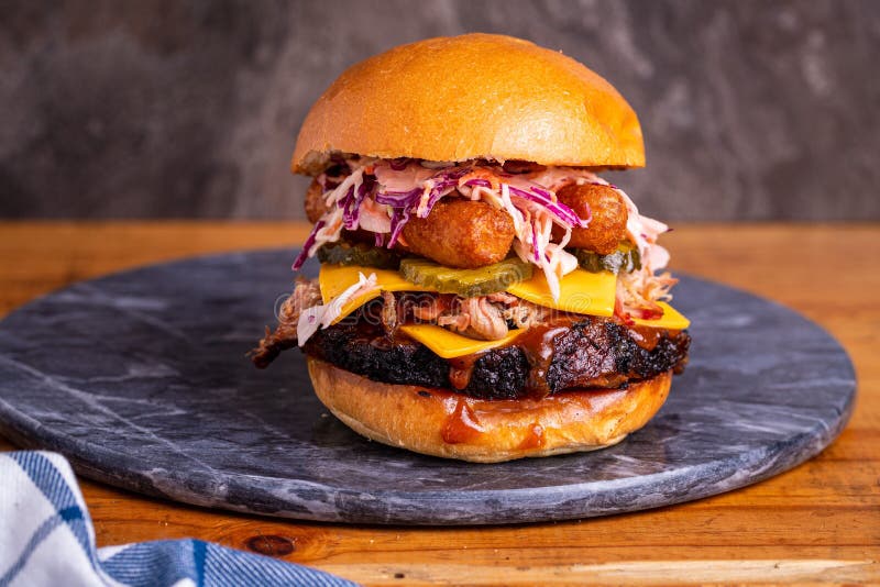 Delicious burger on a dish stock image. Image of onion - 256333237