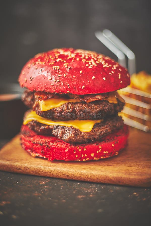 Delicious Burger with Red Bun Stock Photo - Image of delicious, burger ...