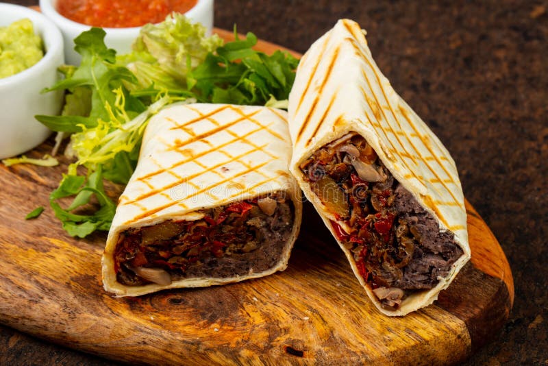 Delicious Burito with Sauce Stock Photo - Image of appetizer, tortilla ...