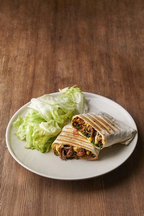 Delicious Burrito on the Plate Stock Photo - Image of delicious, fresh ...