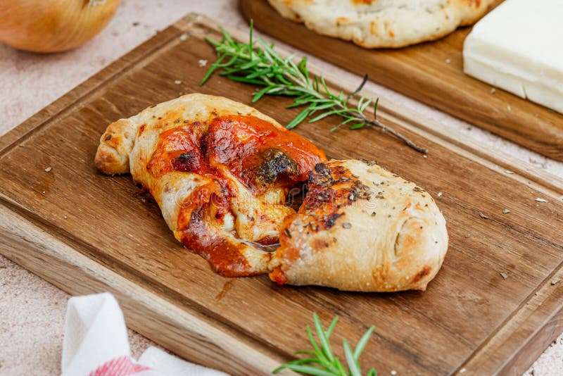 A delicious calzone stock image. Image of baked, meat - 303146787