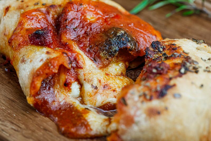 A delicious calzone stock image. Image of sauce, closed - 303146823