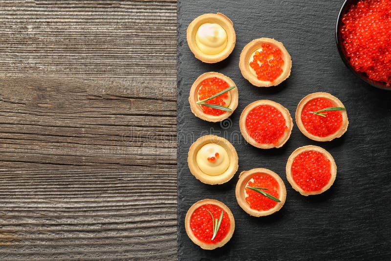 Delicious Canapes with Red Caviar on Slate Plate Stock Photo - Image of ...
