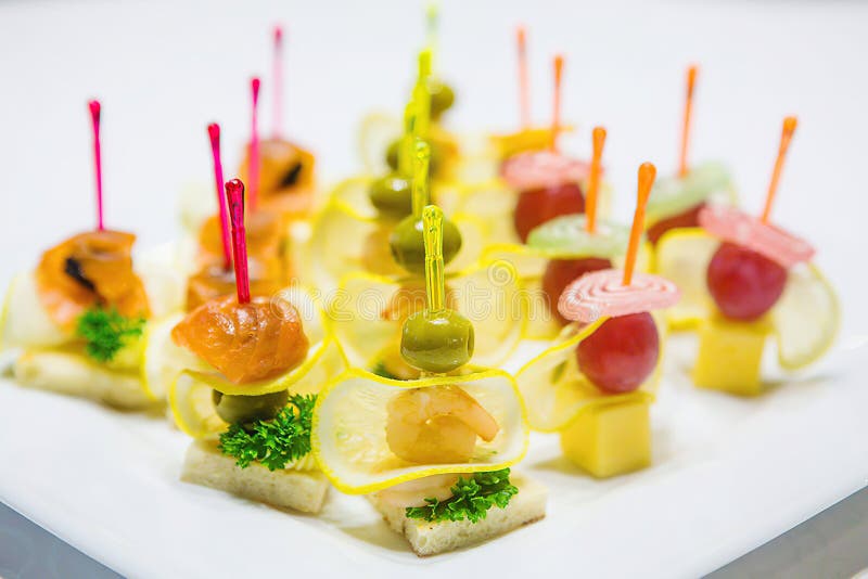 Delicious Canapes with Red Fish. Group of Canapes on a Plate. Stock ...