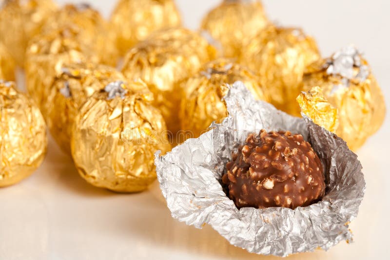 Delicious Candy in Golden Foil Stock Image - Image of chocolate ...