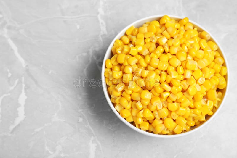Delicious Canned Corn in Bowl on Marble Table, Top View. Space for Text ...