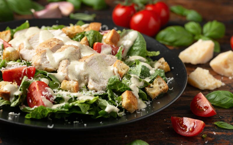 A Delicious Chicken Caesar Salad with Parmesan Cheese, Tomatoes ...