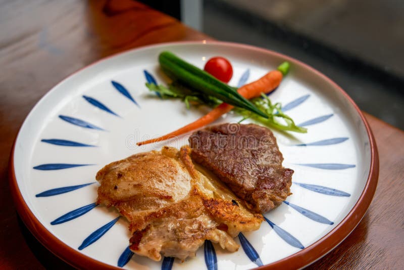 A Delicious Chicken and Steak Pairing in a Western Restaurant Stock ...