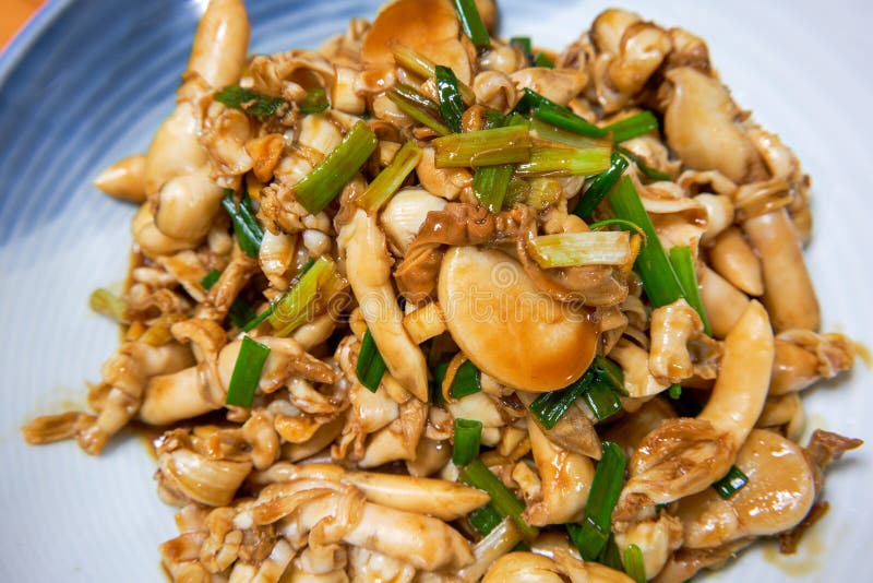 A Delicious Chinese Dish, Fried Razor Clams in Sauce Stock Photo ...