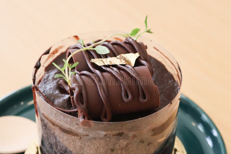 Delicious Chocolate Cake in Ceramic Plate on Dining Table in Cafe ...