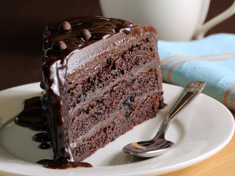 Delicious Chocolate Cake on Plate on Wooden Table Stock Photo - Image ...