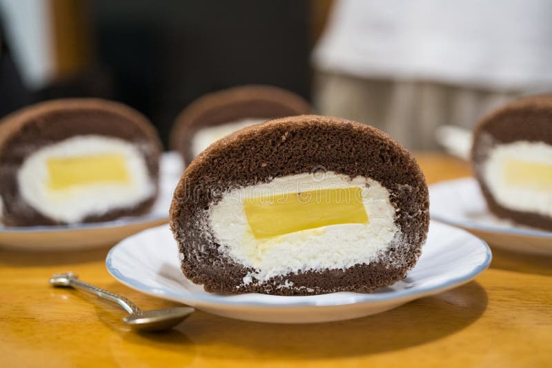 Delicious Chocolate Cake Roll with Cream and Mango Pudding Stock Photo ...