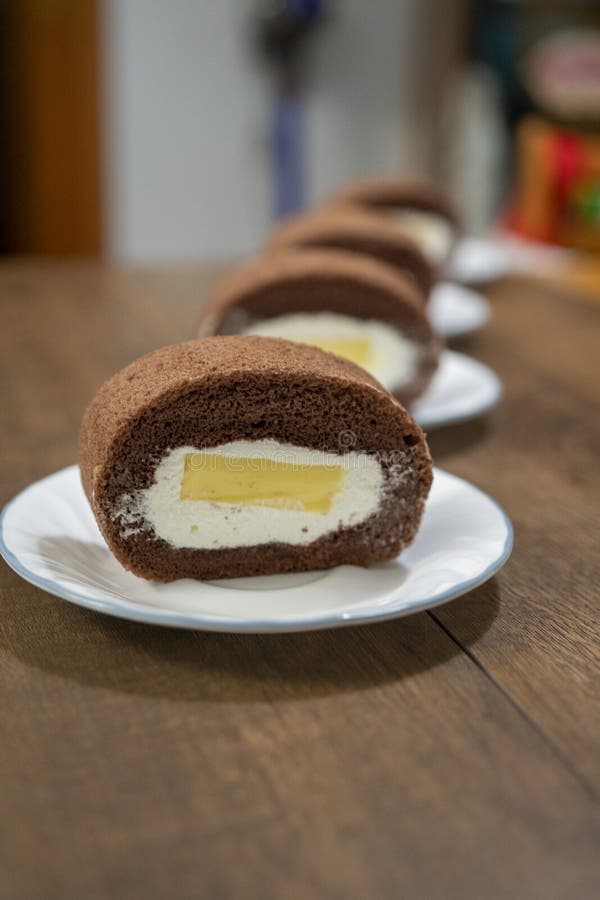 Delicious Chocolate Cake Roll with Cream and Mango Pudding Stock Photo ...