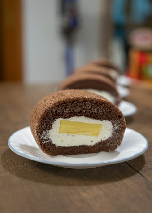 Delicious Chocolate Cake Roll with Cream and Mango Pudding Stock Image ...