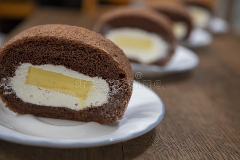 Delicious Chocolate Cake Roll with Cream and Mango Pudding Stock Image ...