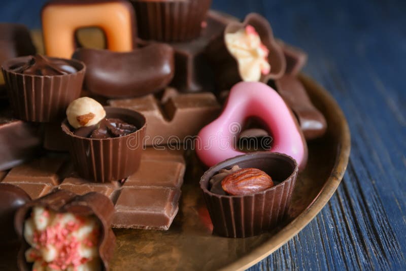 Delicious Chocolate Candies on Plate, Closeup Stock Image - Image of ...