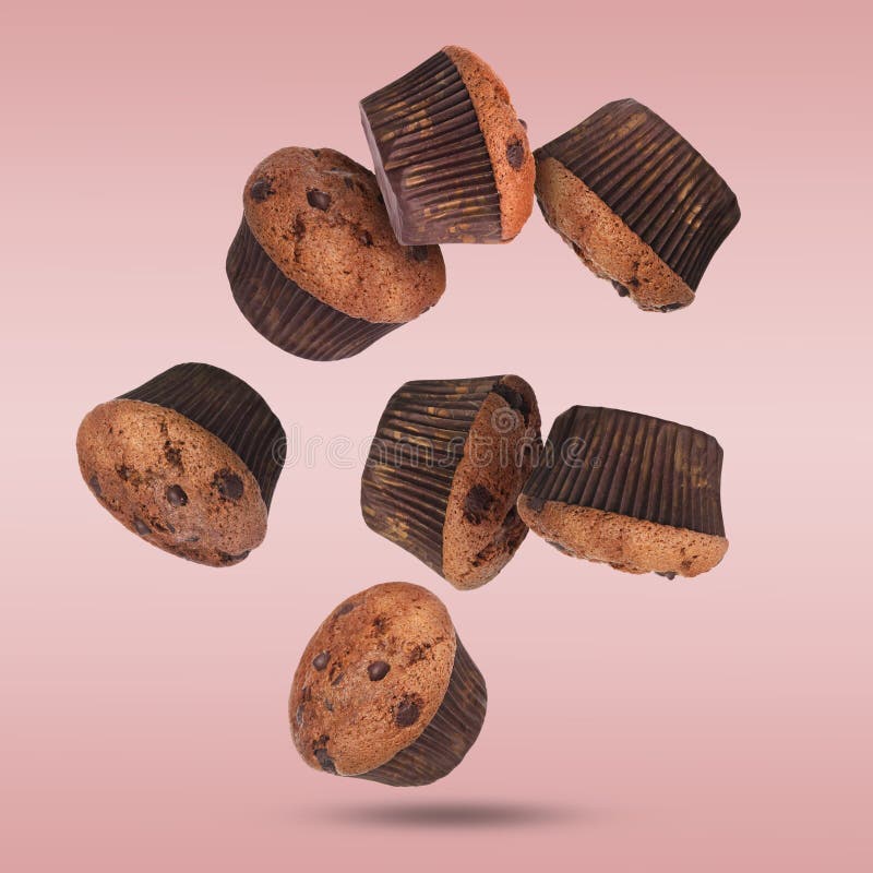 Delicious Chocolate Muffins Falling on Pink Background Stock Image ...