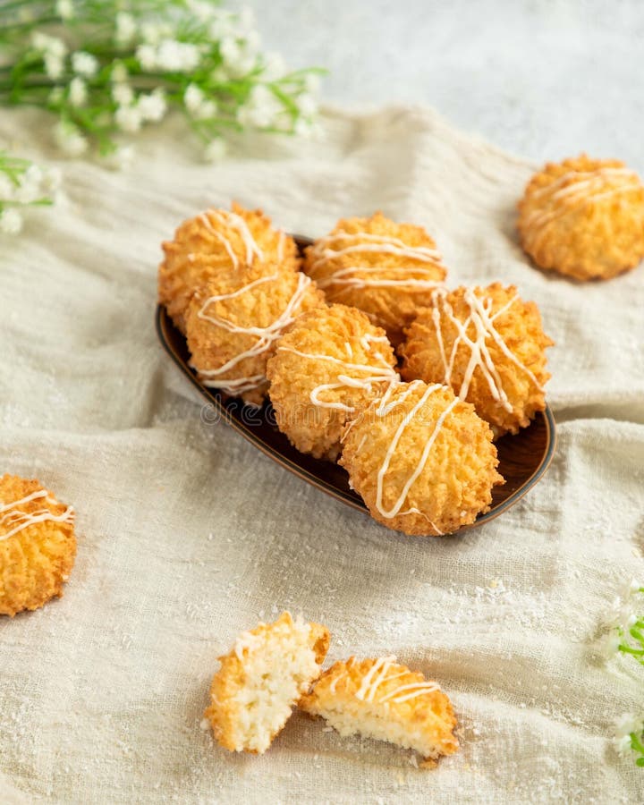 Small Coconut Cookies with White Chocolate are Lying on a Plate Stock ...