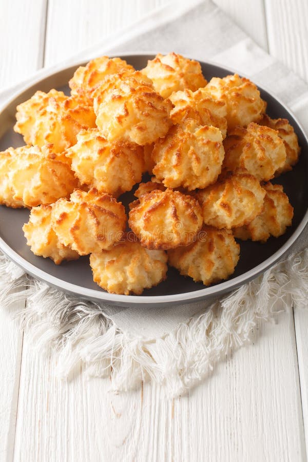 Delicious Coconut Macaroons Cookies Closeup on the Plate. Vertical ...