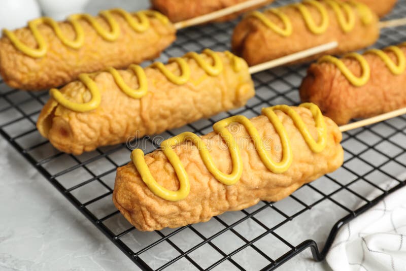 Delicious Corn Dogs with Mustard on Grey Table, Closeup Stock Photo ...