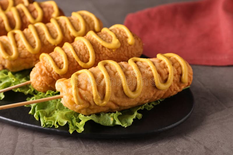 Delicious Corn Dogs with Mustard Served on Grey Table, Closeup Stock ...