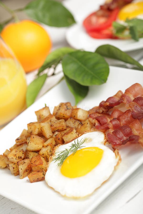 Country Breakfast From Potatoes, With Bacon And Fried Eggs Stock Photo ...
