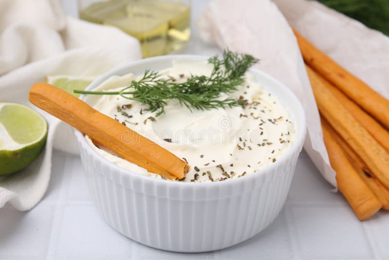 Delicious Cream Cheese with Grissini Stick and Dill on White Tiled ...