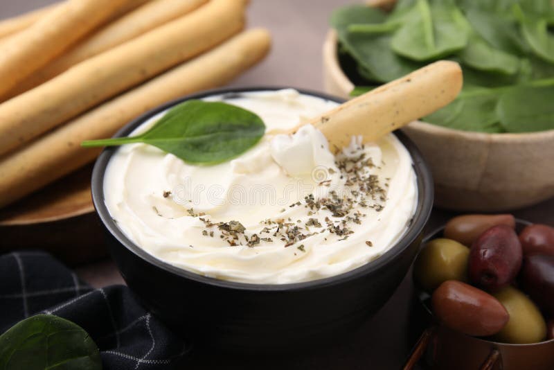 Delicious Cream Cheese with Grissini Stick and Spices on Table, Closeup ...