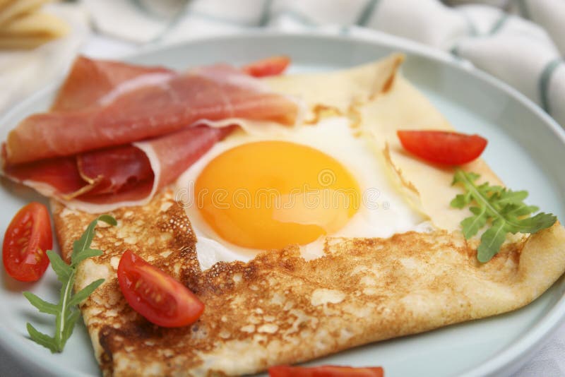 Delicious Crepe with Egg on Plate, Closeup. Breton Galette Stock Photo ...