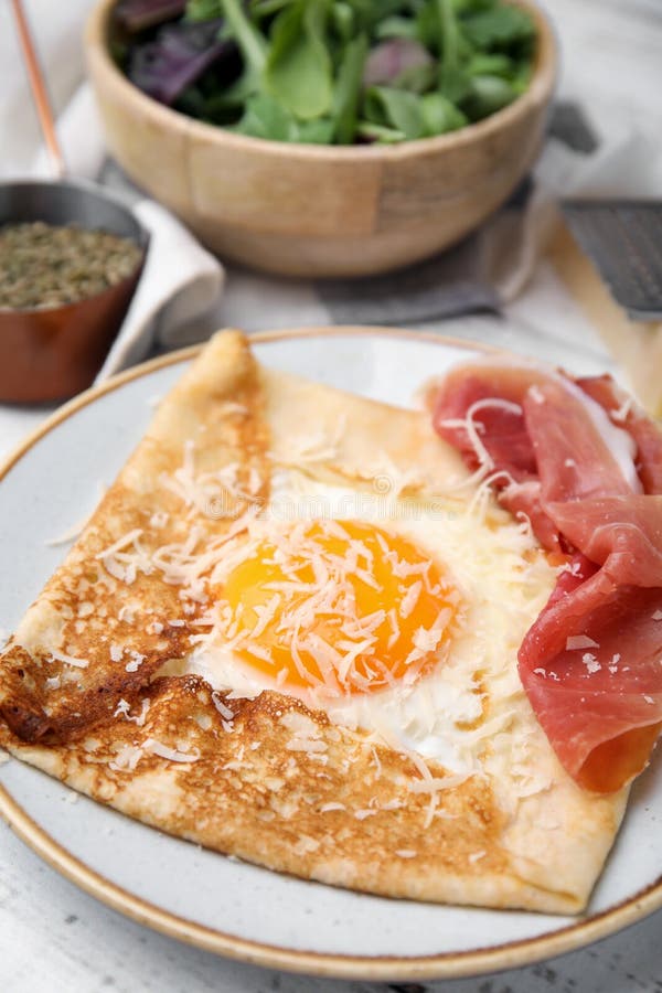 Delicious Crepe with Egg on Table, Closeup. Breton Galette Stock Image ...