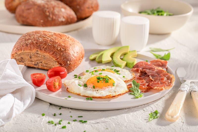 Delicious and Crisp Breakfast with Fried Eggs and Buns Stock Photo ...