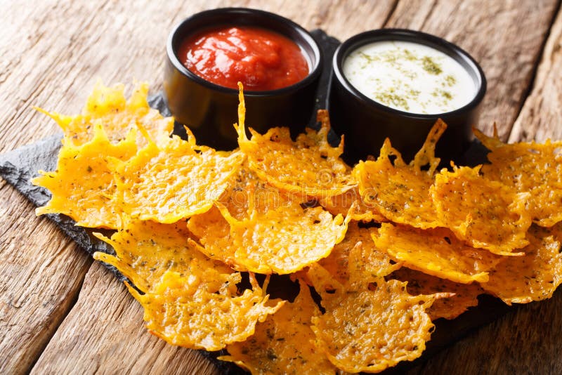 Delicious Crispy Cheddar Cheese Chips with Herbs with Sauces Close-up ...