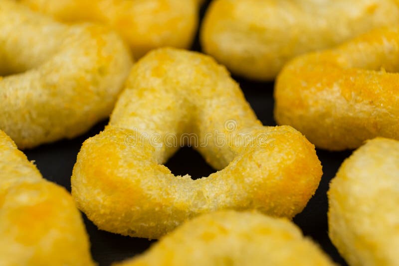 Delicious Crispy Corn Chips Triangular Shape with Spices on a Black ...