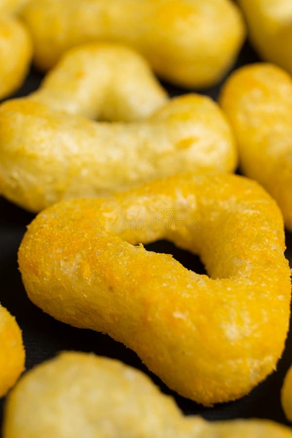 Delicious Crispy Corn Chips Triangular Shape with Spices on a Black ...