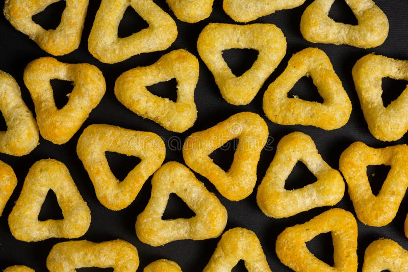 Delicious Crispy Corn Chips Triangular Shape with Spices on a Black ...