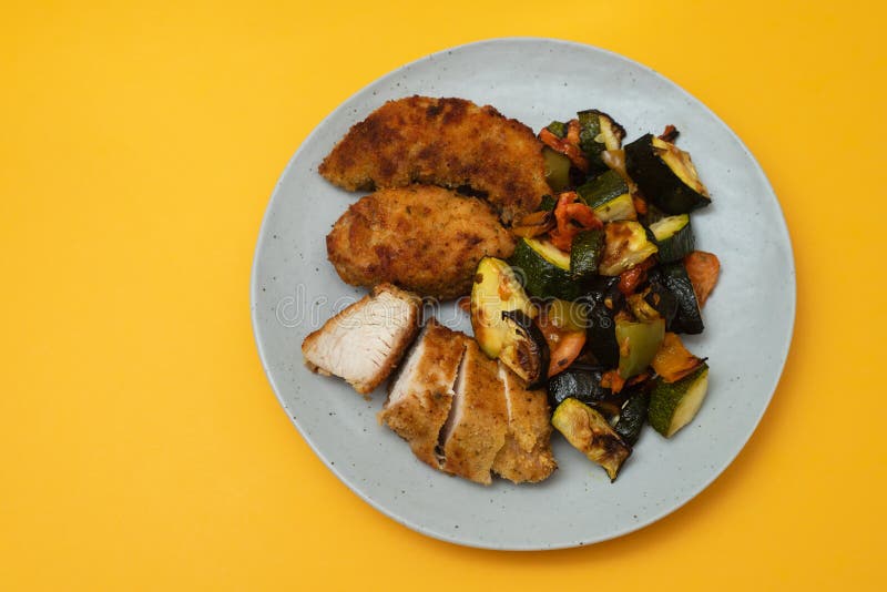 Delicious Crispy Fried Breaded Chicken Breast Strips with Baked ...