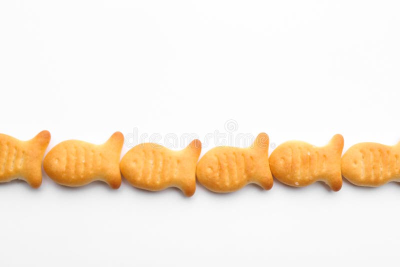 Delicious Crispy Goldfish Crackers on White Background, Top View Stock ...