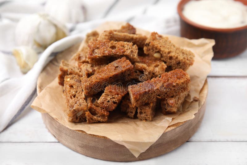 Delicious Crispy Rusks with Sauce on White Wooden Table Stock Photo ...