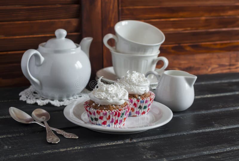 Delicious Cupcakes and a Tea Set on a Wooden Table. Tea Time Stock ...