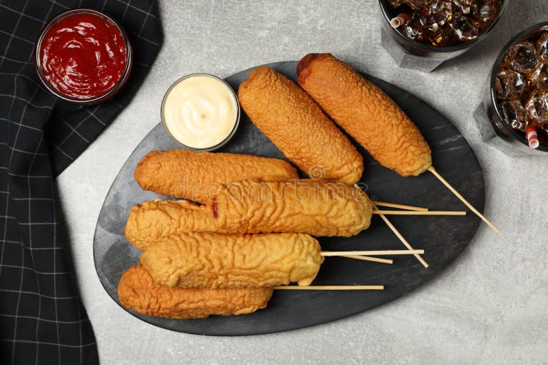 Delicious Deep Fried Corn Dogs with Board and Sauces on Light Grey ...