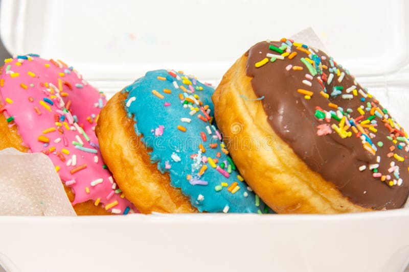 Delicious Dessert. Pink, Blue and Chocolate Donuts with Multicolored ...