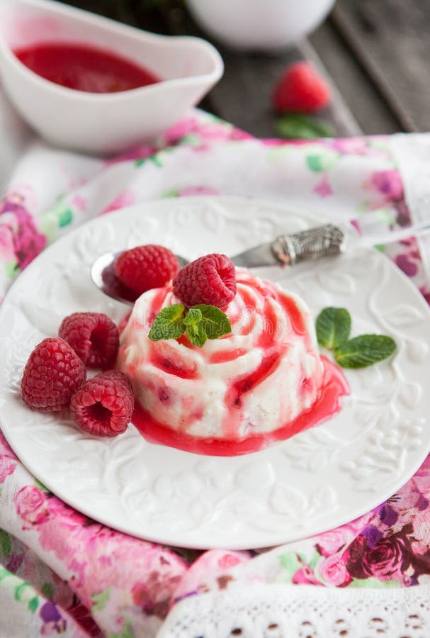 Delicious Dessert with Raspberry Sauce and Berries Stock Photo - Image ...