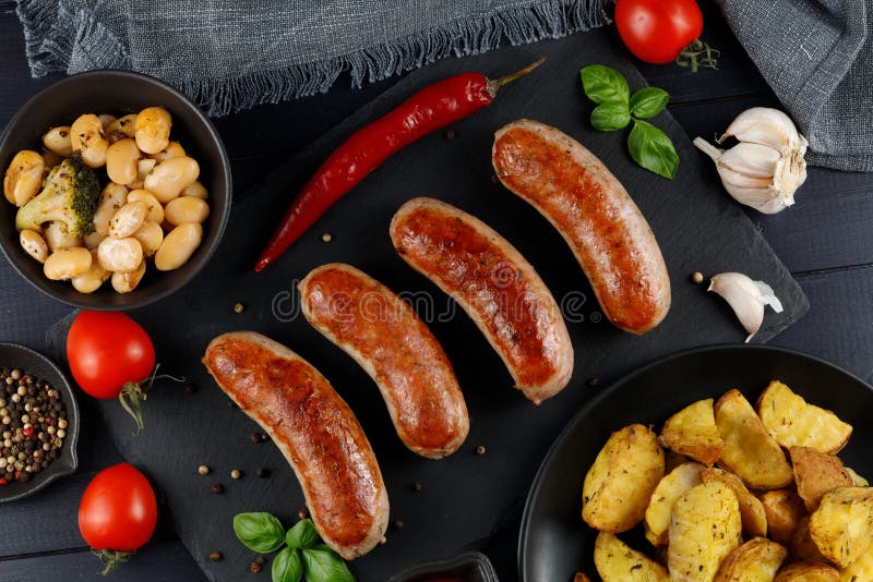 Delicious Dish with Fried Sausages Top View. Lunch in a Restaurant ...