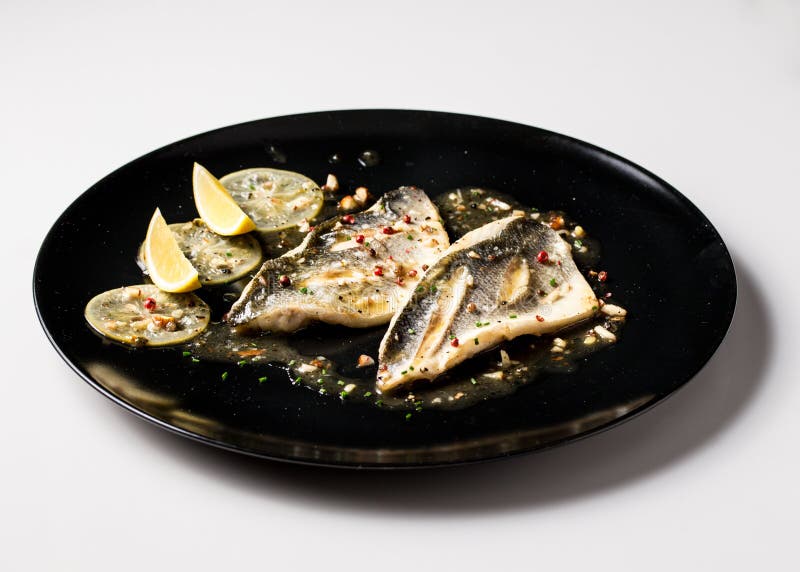 Delicious Dish Made of Cooked Fish Garnished with Salt, Pepper, and ...