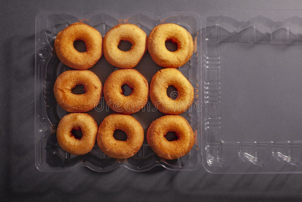 Delicious Donuts in a Plastic Container Stock Photo - Image of fried ...