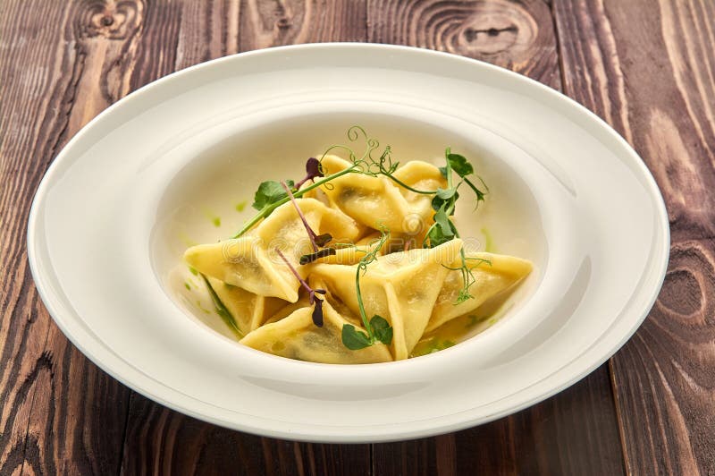 Delicious Dumplings in a Deep Dish Stock Image - Image of cooking, dish ...
