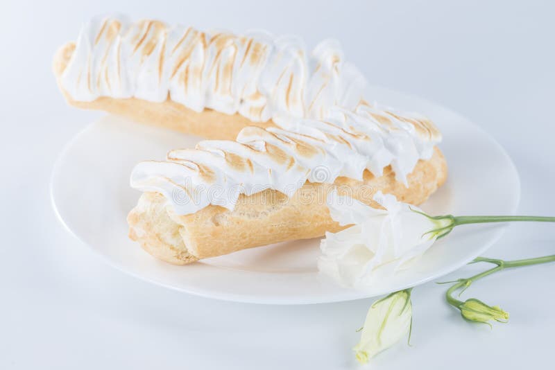 Delicious Eclair on a Plate and Flower Eustoma Stock Image - Image of ...