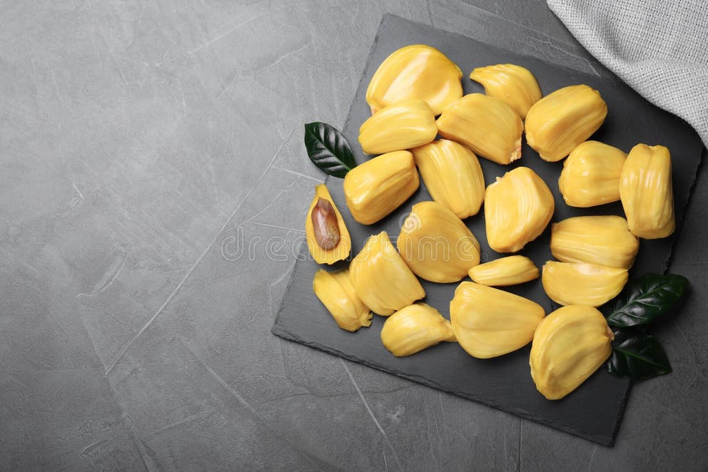 Delicious Exotic Jackfruit Bulbs on Grey Table, Top View. Space for ...