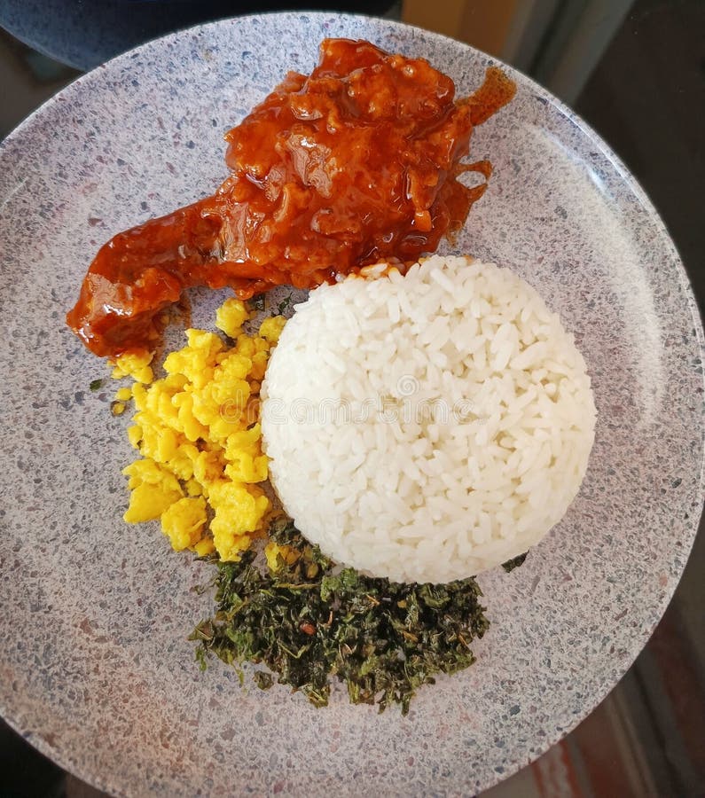 Delicious Fire Chicken Rice with Scrambled Egg and Fried Spinach Stock ...