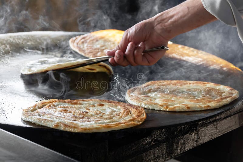Delicious Flatbread Cooking on Hot Surface Stock Photo - Image of ...